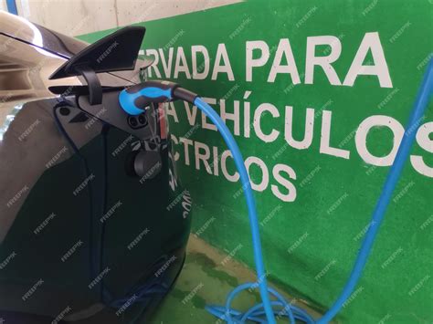 Premium Photo Charging A Electric Car In A Public Parking Lot They Are The Future With Their
