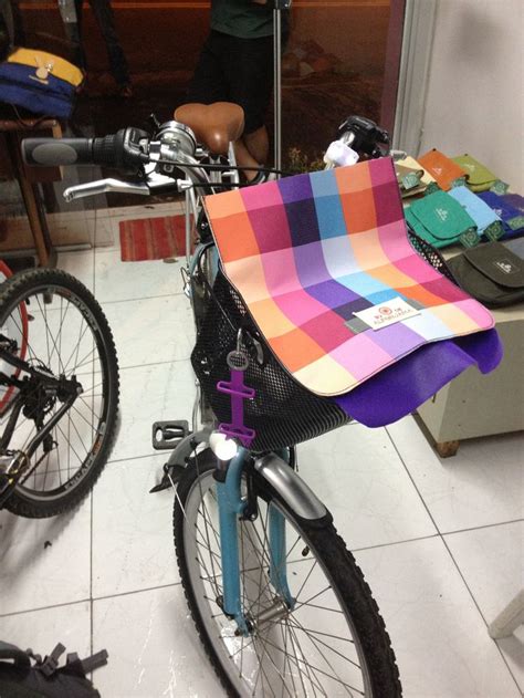 A Bicycle With A Colorful Blanket On The Back