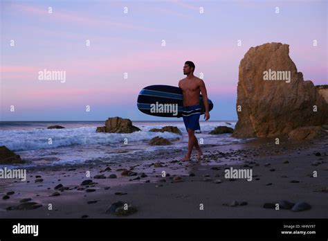 Man Surfboard Sunrise Rock Hi Res Stock Photography And Images Alamy