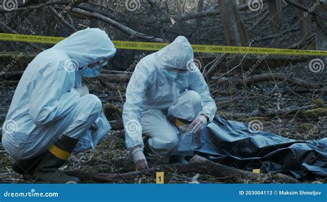 Detectives Are Collecting Evidence In A Crime Scene Forensic