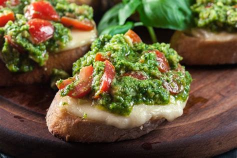 Bruschetta With Fresh Pesto Mozzarella And Cherry Tomatoes On C Stock