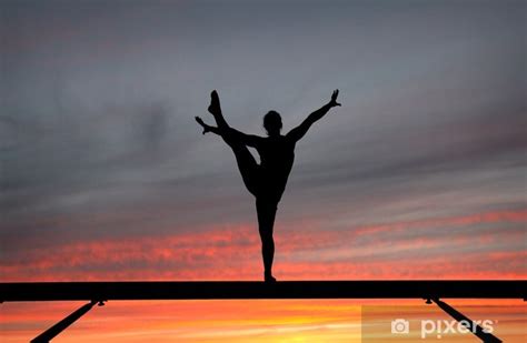 Wall Mural Silhouette Of Female Gymnast On Balance Beam In Sunset