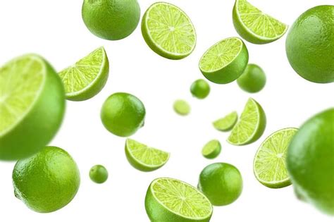 Limes With Leaves And Slices On A White Background