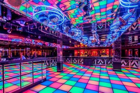 A Brightly Lit Dance Floor With Disco Lights