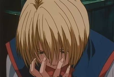 An Anime Character With Blonde Hair Holding His Hands To His Face