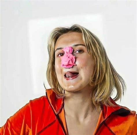 A Woman With A Fake Pig Nose On Her Face