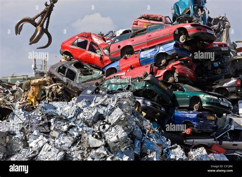 Unwanted Old Cars Scrapped And Crushed Into Cubes At Recycling