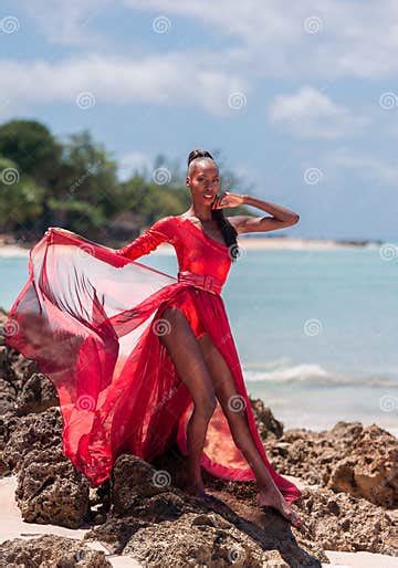Woman Wearing Red Bikini And Dress On A Tropical Beach Remote Tropical Beach In Barbados