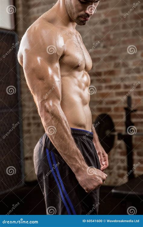 Midsection Of A Shirtless Man Showing His Body Stock Photo Image Of