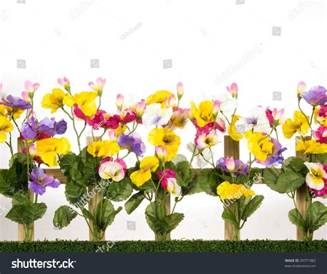 Wooden Picket Fence Artificial Pansies Flowers Stock Photo