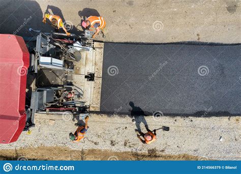 Aerial View Of New Road Construction With Asphalt Laying Machinery At
