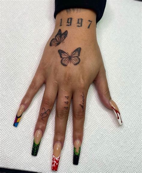 Details Butterfly Hand Tattoo Best In Cdgdbentre