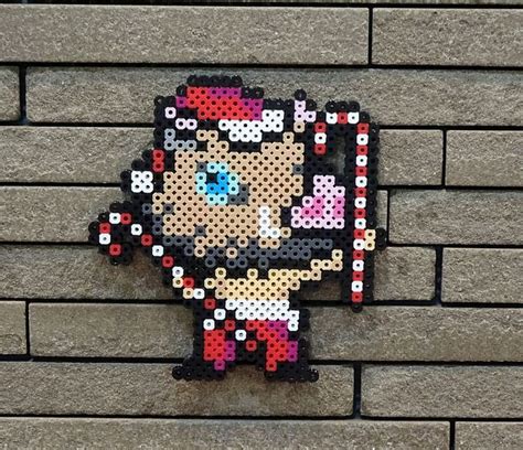 A Pixel Art Piece On The Side Of A Brick Wall