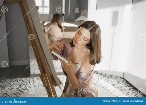 Pretty Talented Woman Painter Painting On Easel Making Colorful