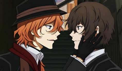 Two People Standing Next To Each Other Wearing Hats