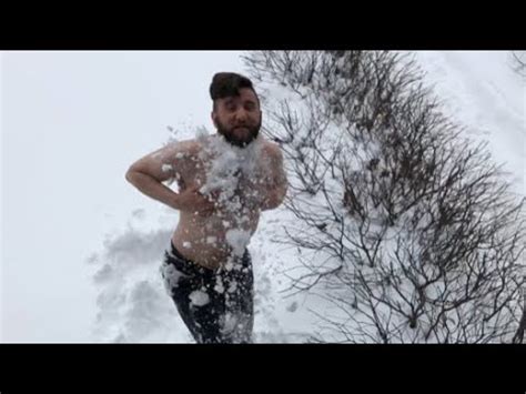 EMBRACING THE COLD HALF NAKED IDIOT JUMPS OFF BALCONY INTO THE SNOW
