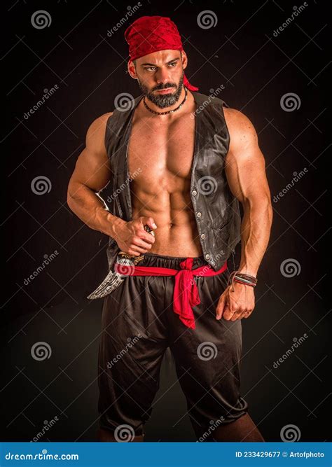 Muscular Male Pirate In Studio Shot Wearing Bandana And Open Vest