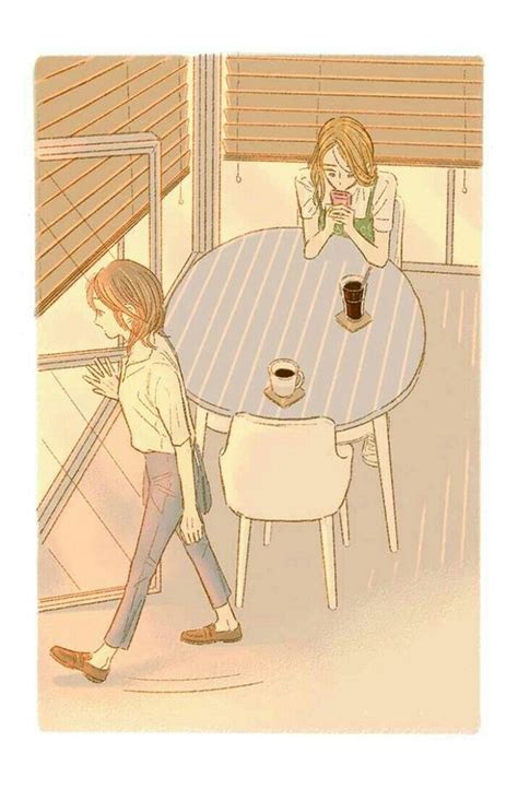 Two People Sitting At A Table In Front Of An Open Refrigerator