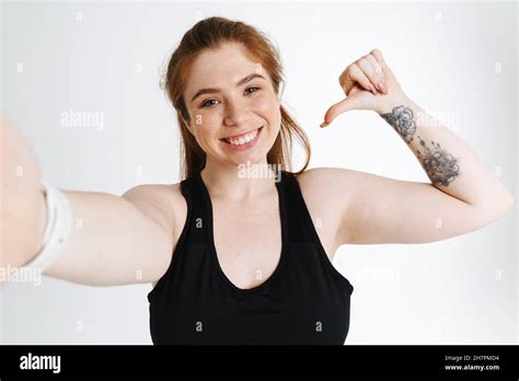 Ginger Woman Pointing Finger At Herself While Taking Selfie Photo Isolated Over White Background