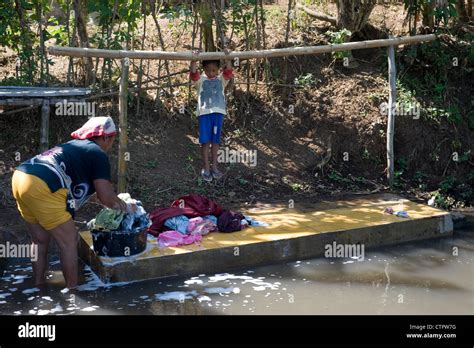 Local Village Woman Doing Laundry In River Java Indonesia Stock Photo