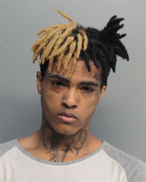 A Man With Dreadlocks On His Head Is Shown In This Mugshot Photo