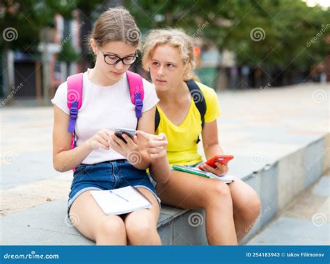 Two Schoolgirls Doing Their Homework Outdoors Stock Image Image Of Female Caucasian 254183943