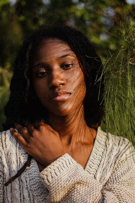 Portrait Of A Black Girl With Dreads During Golden Hour Del Colaborador De Stocksy Maingaila