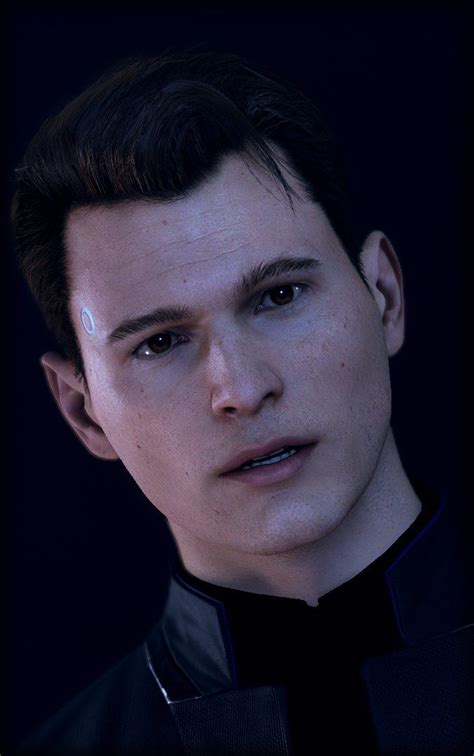 A Close Up Of A Person Wearing A Black Shirt And Tie With An Evil Look