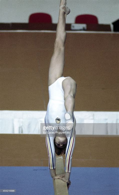 Gymnast Nadia Comaneci Of Romania In Action On The Balace Beam During