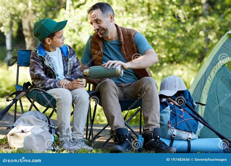 Father And Son Relaxing At Camp Stock Photo Image Of Happiness