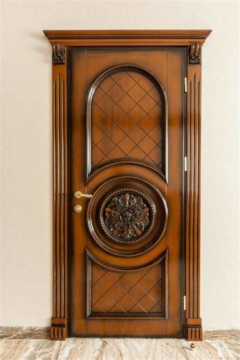 A Wooden Door With An Ornate Design On The Front And Side Panels Is