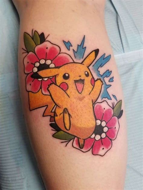 A Pokemon Tattoo With Flowers And A Pikachu