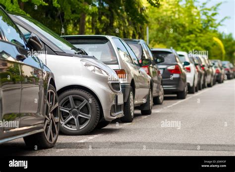 Rows Of Cars Parked On The Roadside In Residential District Small Car