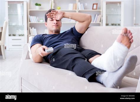 Man With Broken Leg Recovering At Home Stock Photo Alamy