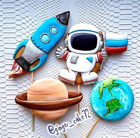 Cake Toppers Made To Look Like Outer Space With Rocket Earth And