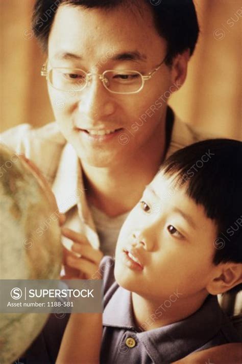 Father Teaching His Son SuperStock
