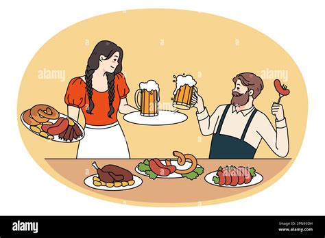 Happy Man And Woman In Traditional Clothes Celebrate Oktoberfest Drink