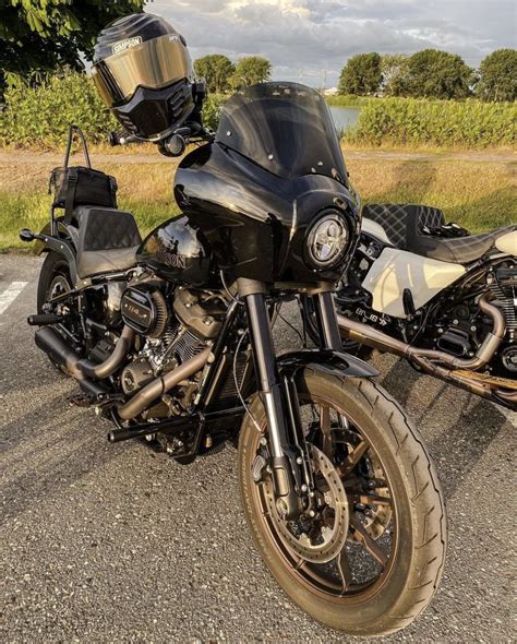 Harley Motorcycles Parked On The Road