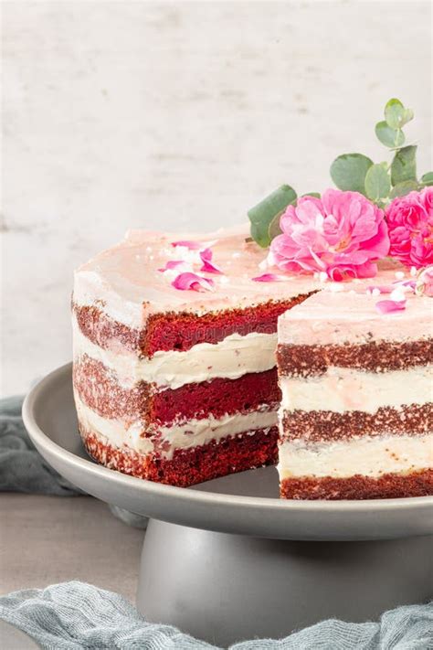 Red Velvet Naked Cake With Fresh Roses And Swiss Buttercream On Kitchen