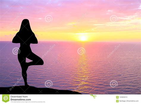Silueta De La Yoga Practicante De La Mujer Durante Imagen De Archivo