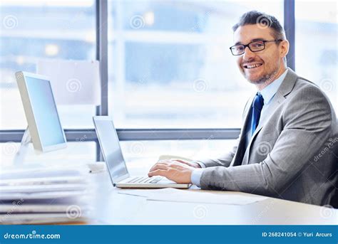 I May Have The Best Job In The World Portrait Of A Smiling Businessman Working On A Laptop In