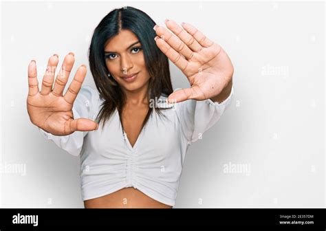 Young Latin Transsexual Transgender Woman Wearing Casual Clothes Doing Frame Using Hands Palms