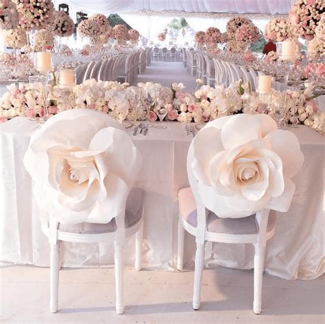 There Are Two Chairs With Flowers On Them