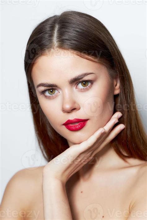 Woman Naked Shoulders Holds Hand Near Chin Red Lips Charm Clear Skin
