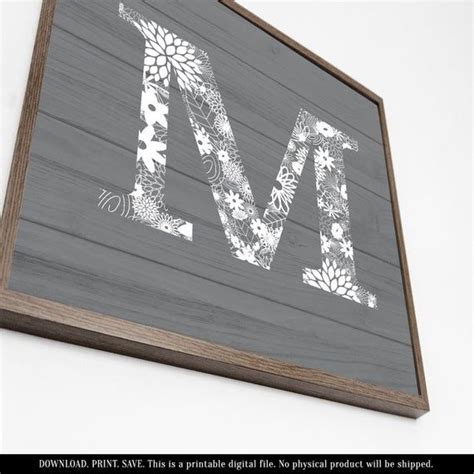 A Wooden Sign With The Letter M Painted On It