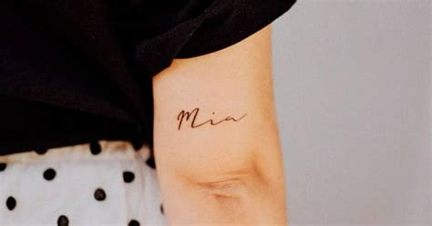 Mia Lettering Tattoo On The Tricep