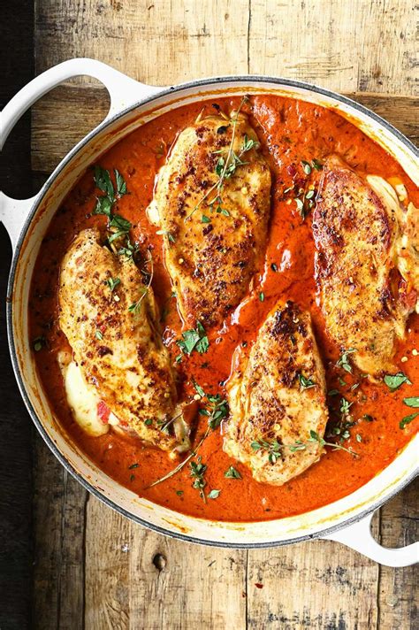 Mozzarella Stuffed Chicken In Creamy Tomato Sauce Serving Dumplings