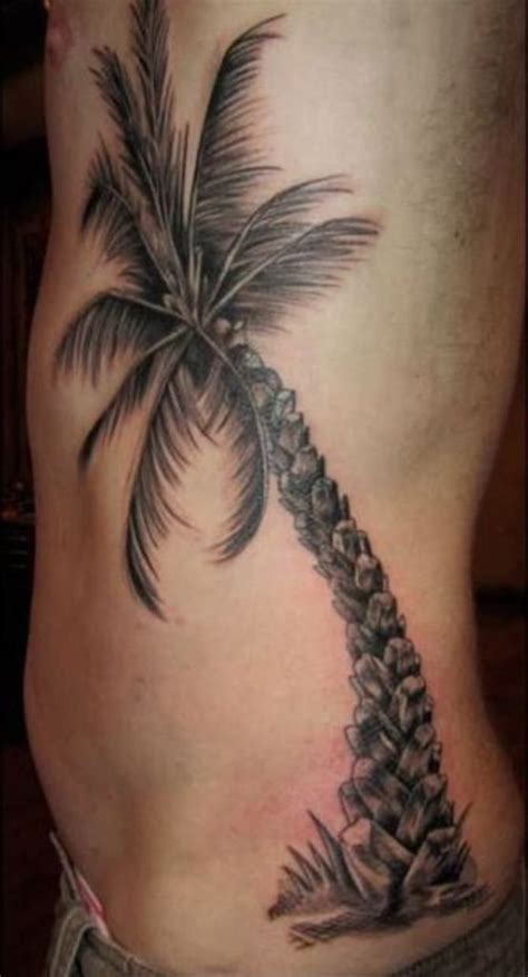 A Man S Stomach With A Palm Tree Tattoo On The Side And His Lower Back