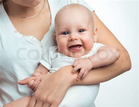 Baby Boy In The Comfort Of Moms Arms Stock Image Colourbox