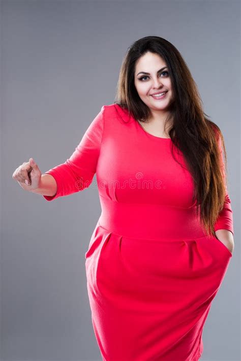 Happy Brunette Plus Size Model In Red Dress Fat Woman With Long Hair On Gray Background Body